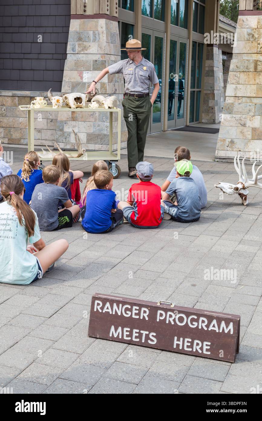 Park ranger talking to young children as part of the Junior Ranger ...