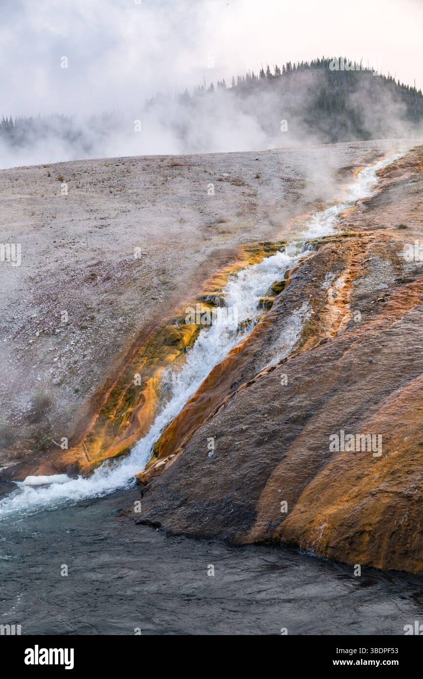 Run-off water from geysers and springs flows into the Firehole River in ...