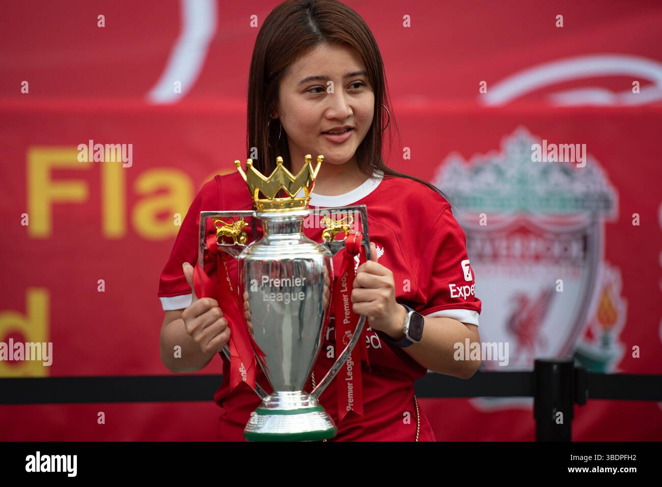 A general view of the atmosphere Fans Liverpool pose with a replica ...