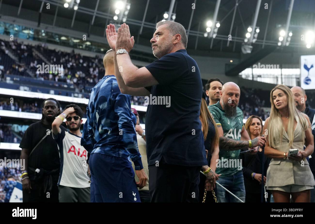 Tottenham Hotspur manager Ange Postecoglou applauds the fans after the ...