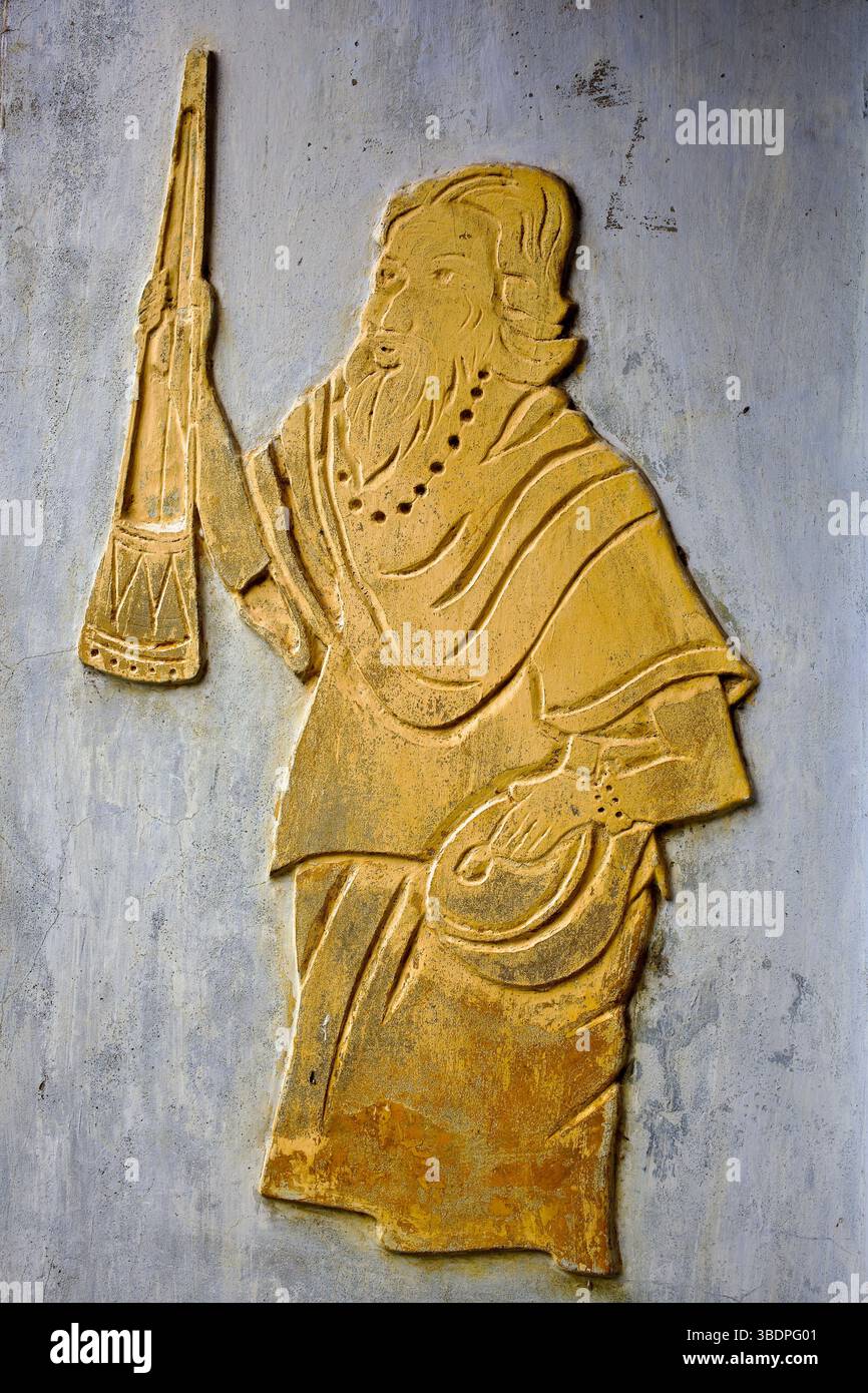 Relief of a Baul singer holding ektara and duggi drum on a wall at ...