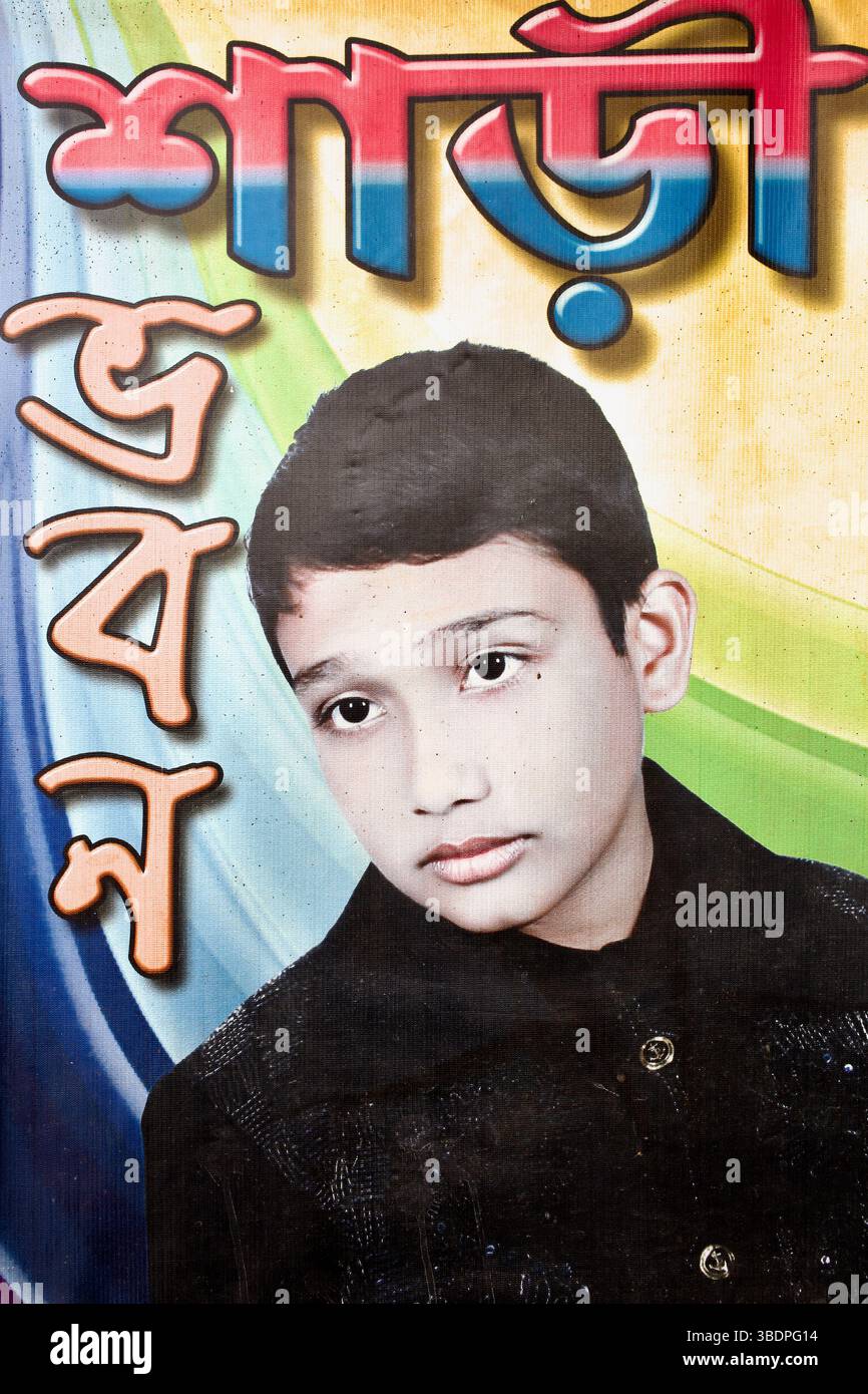 Studio portrait of a boy in festive dress used in textile retail ...
