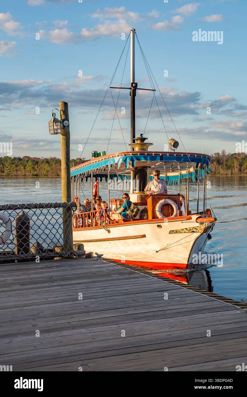 Boat carrying park guests between parks headed to the dock in Fort ...