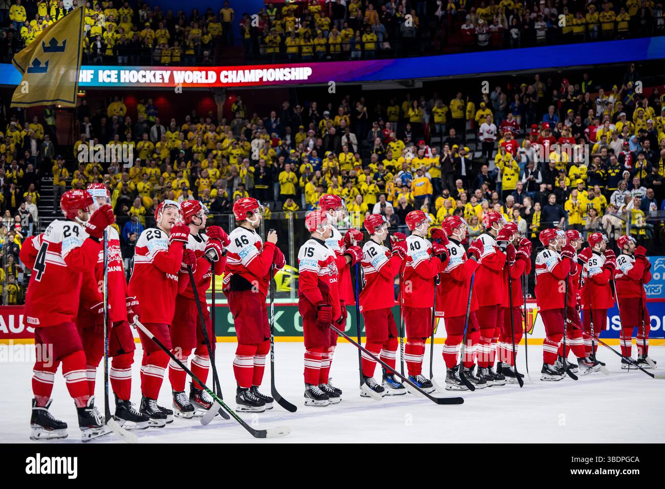 Players of, Denmark. , . look dejected after the 2025 IIHF Ice Hockey World Championship bronze ...