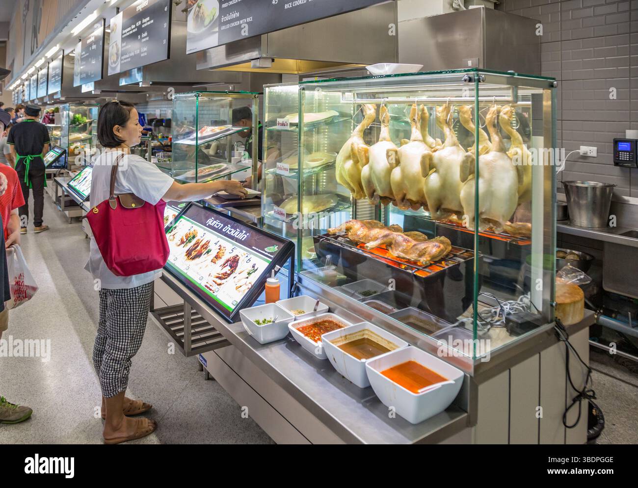 Thai woman ordering food in the cafeteria at the Big C Supercenter in ...