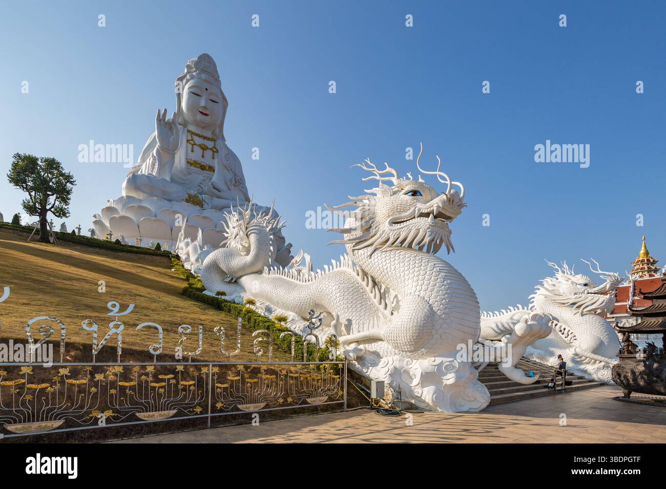Chinese dragons line the steps up to the Guan Yin (Goddess of Mercy) statue at Wat Huay Pla Kang ...