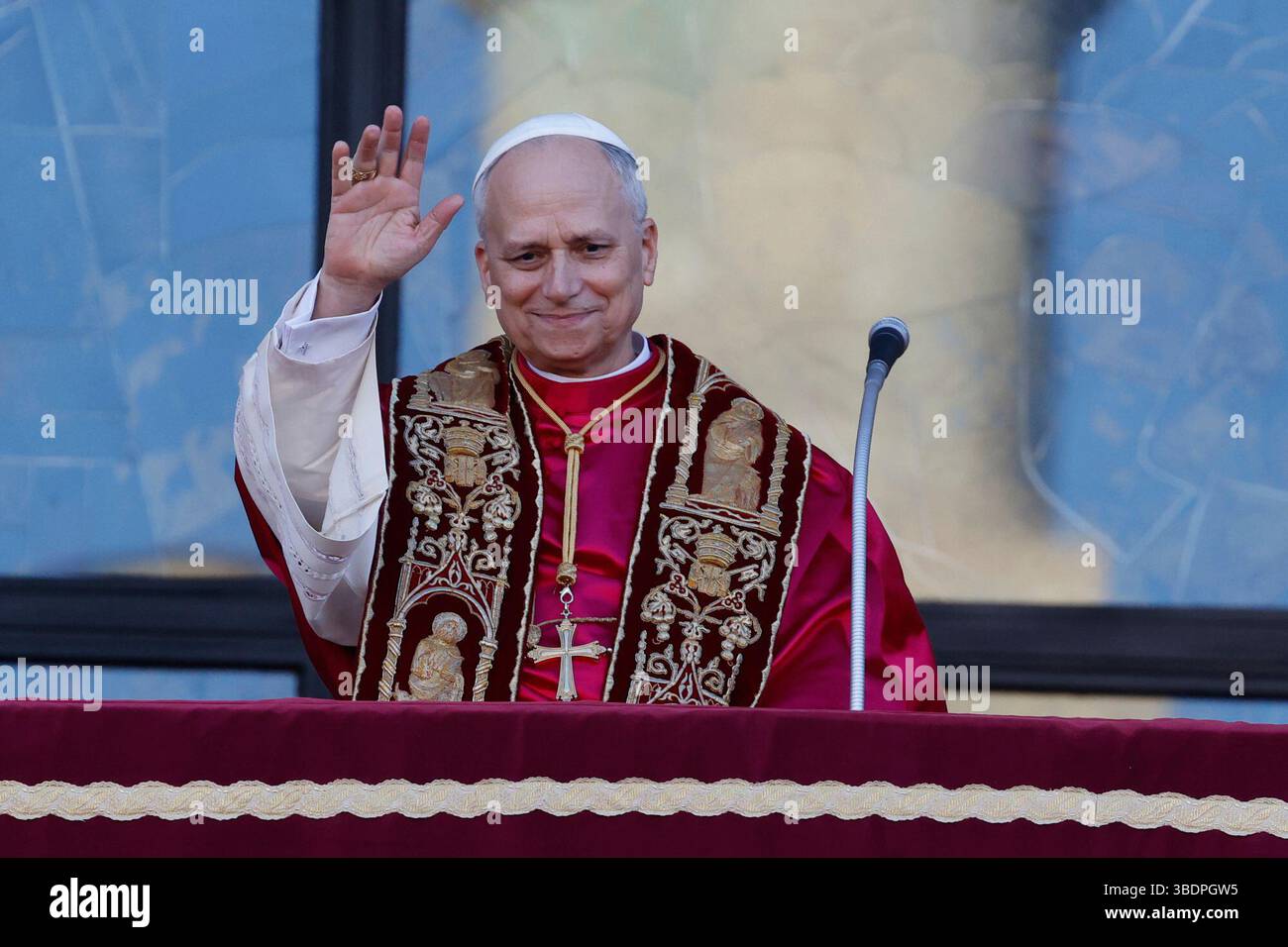 Pope Leo XIV waves as he appears from the balcony at the Basilica of St ...