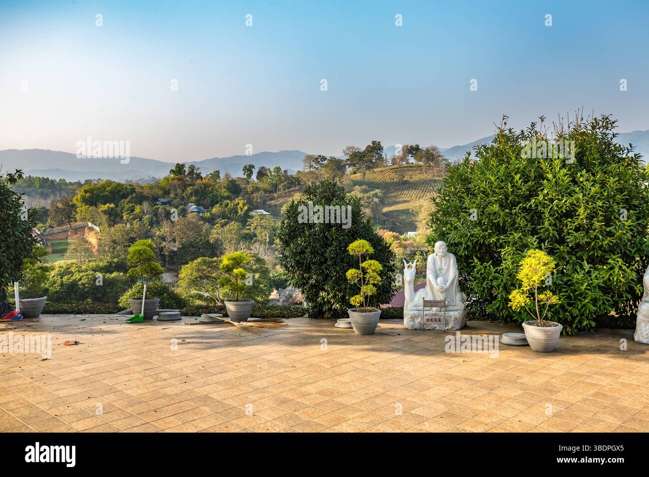 Statue at base of the Guan Yin (Goddess of Mercy) statue at Wat Huay ...