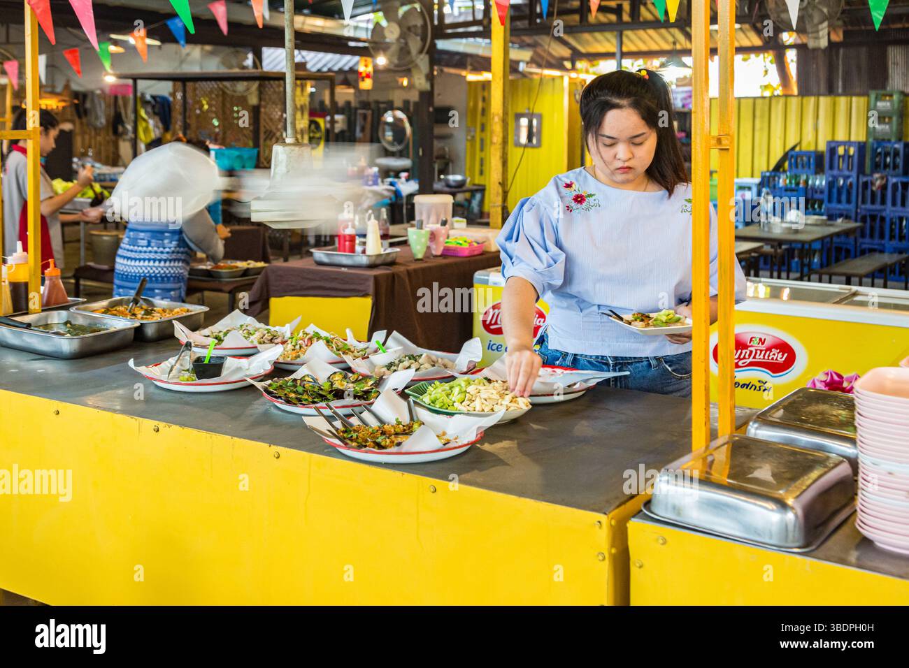 Selection of prepared foods available for customers at a buffet style ...