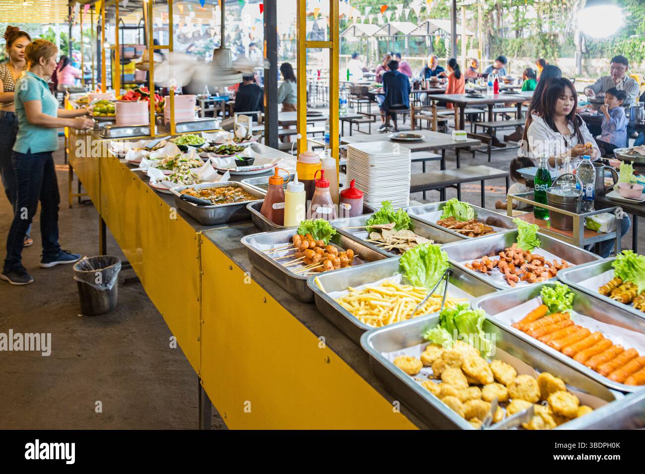 Selection of prepared foods available for customers at a buffet style ...