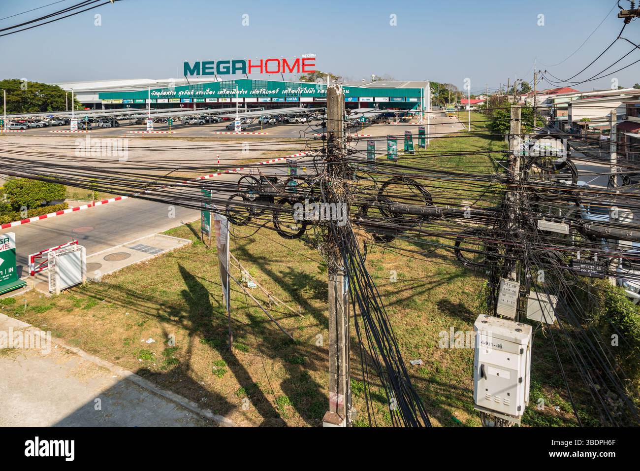 Tangled mess of utility wires in front of the Mega Home Center building ...