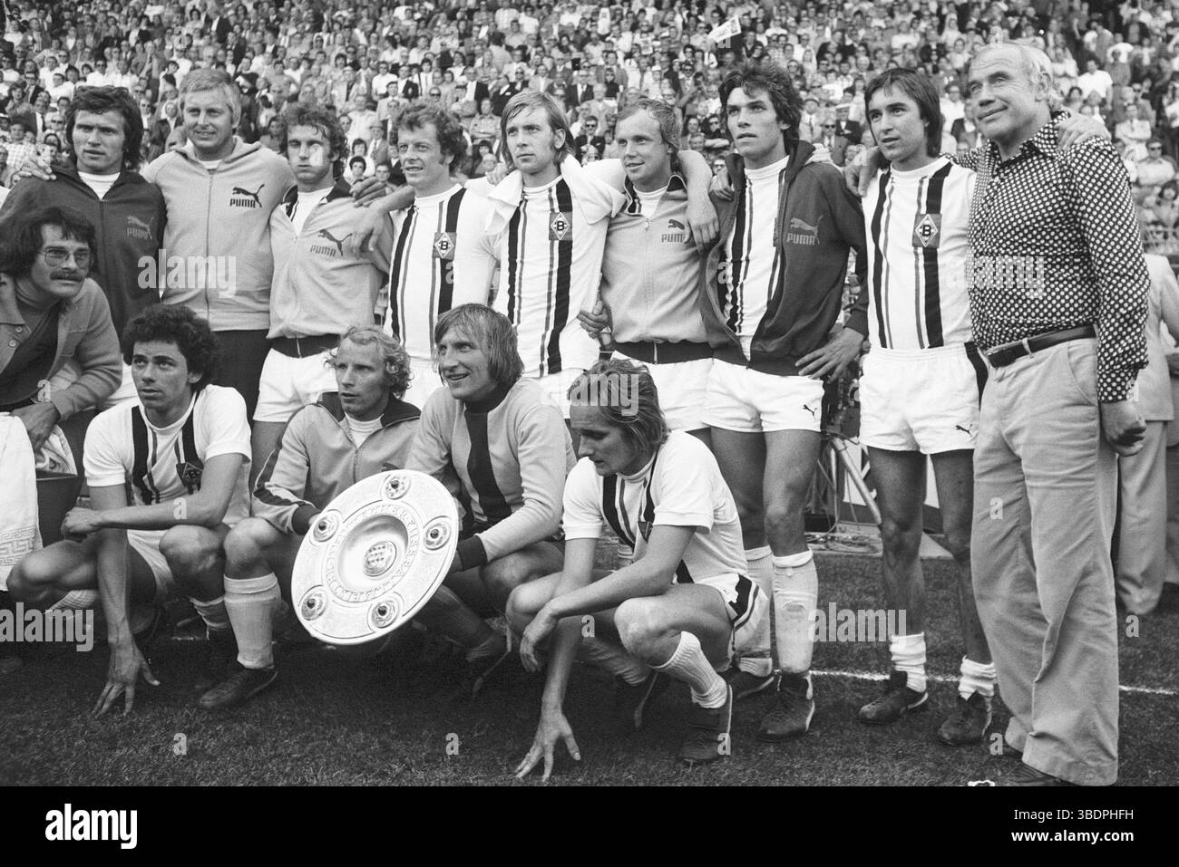 The team with the championship trophy, standing left to right masseur ...