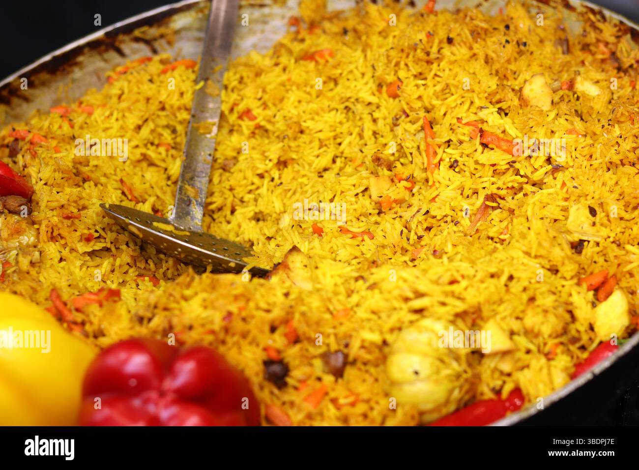 Plov cooked in a cauldron. Food at the food court. Plov with meat ...