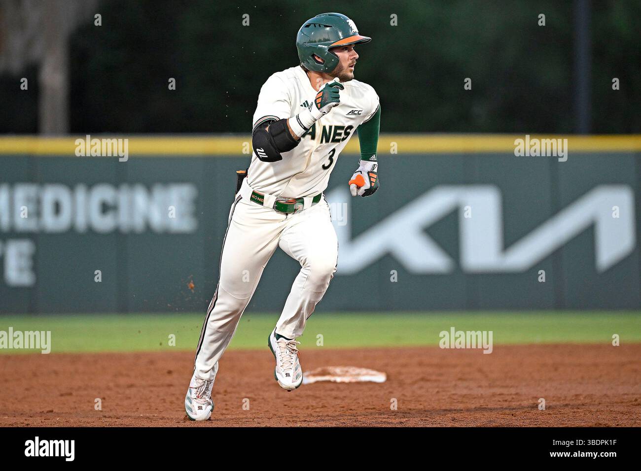 CORAL GABLES, FL - MAY 16: Miami outfielder Michael Torres (34) runs to ...