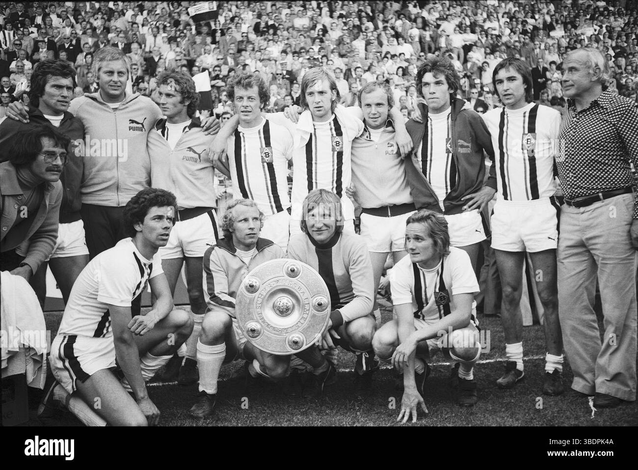 The team with the championship trophy, standing left to right masseur ...