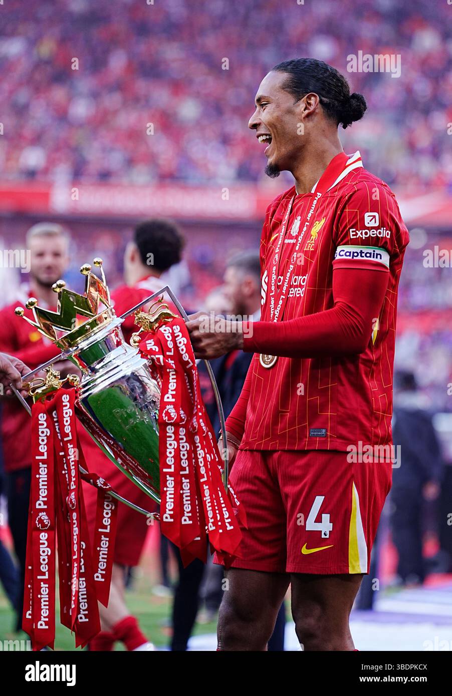 Liverpool's Virgil van Dijk celebrates with the Premier League trophy ...
