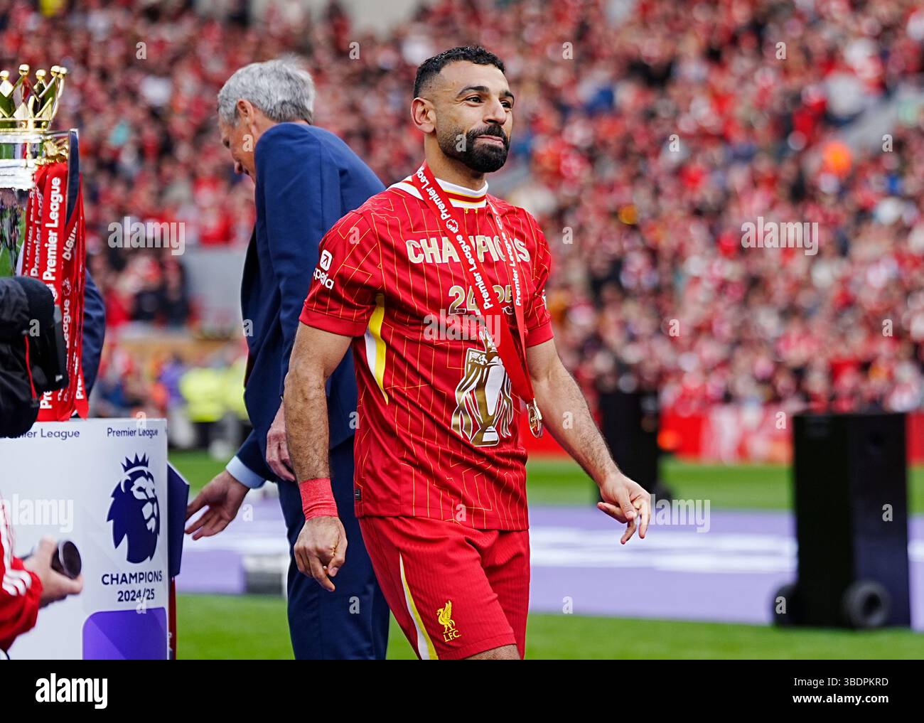 Liverpool's Mohamed Salah collects his winner's medal after the Premier ...