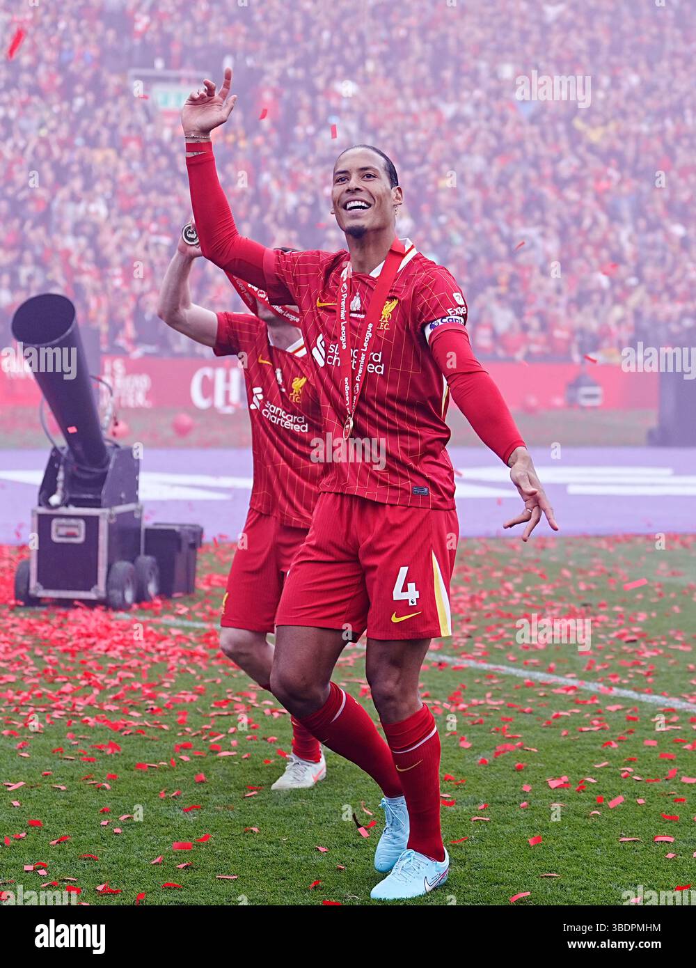 Liverpool's Virgil van Dijk celebrates with his winner's medal after ...