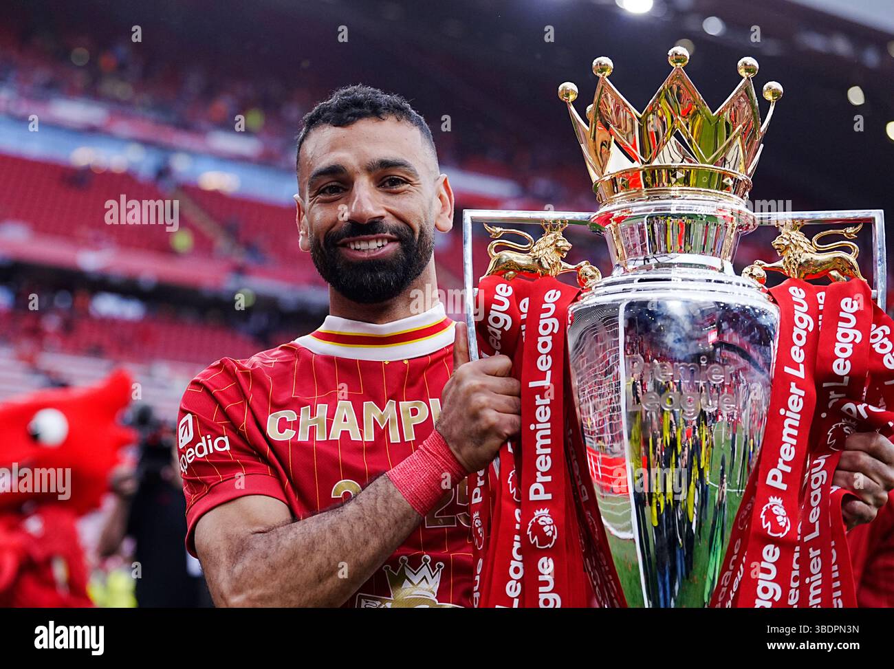 Liverpool's Mohamed Salah celebrates with the Premier League trophy ...