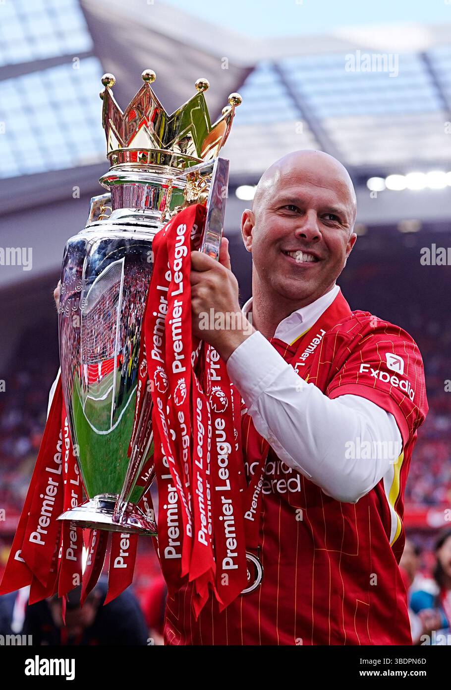Liverpool manager Arne Slot celebrates with the Premier League trophy ...