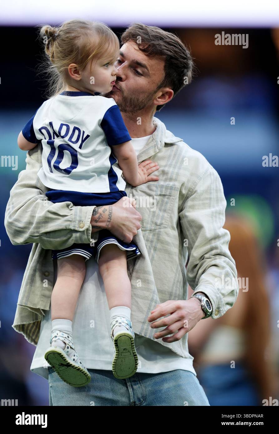 Tottenham Hotspur's James Maddison on the pitch with his family after ...