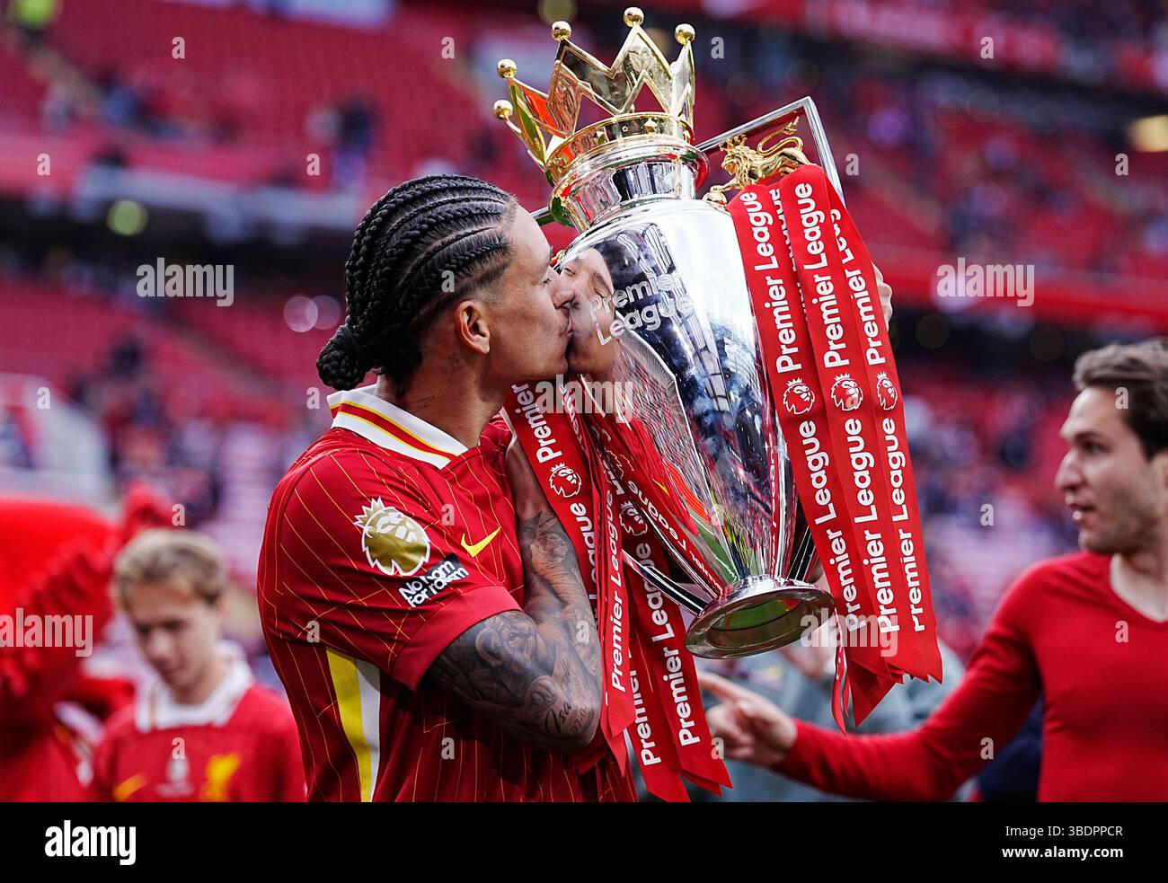 Liverpool's Darwin Nunez celebrates with the Premier League trophy ...