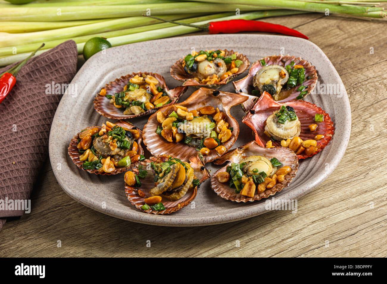 Baked scallops with scalion oil and green onion Stock Photo - Alamy