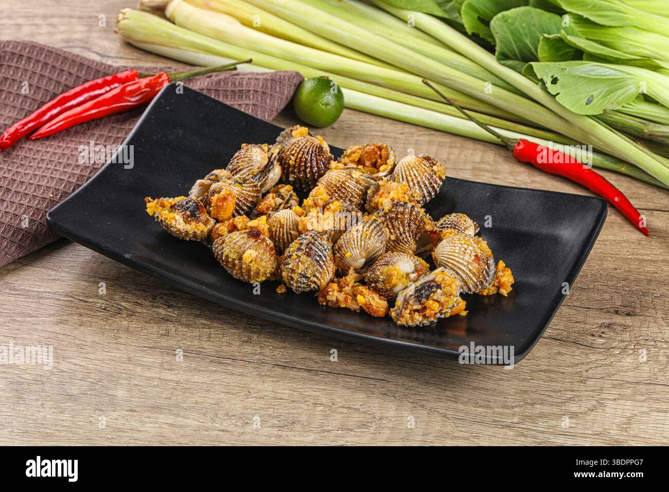 Blood Cockle Fried With Garlic and spices Stock Photo - Alamy