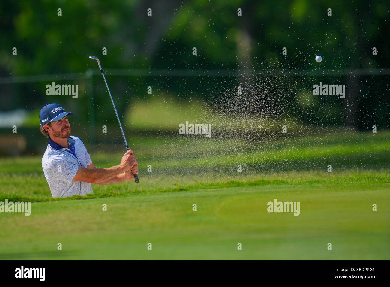 Sam Ryder hits out of a bunker on the tenth hole during the final round ...