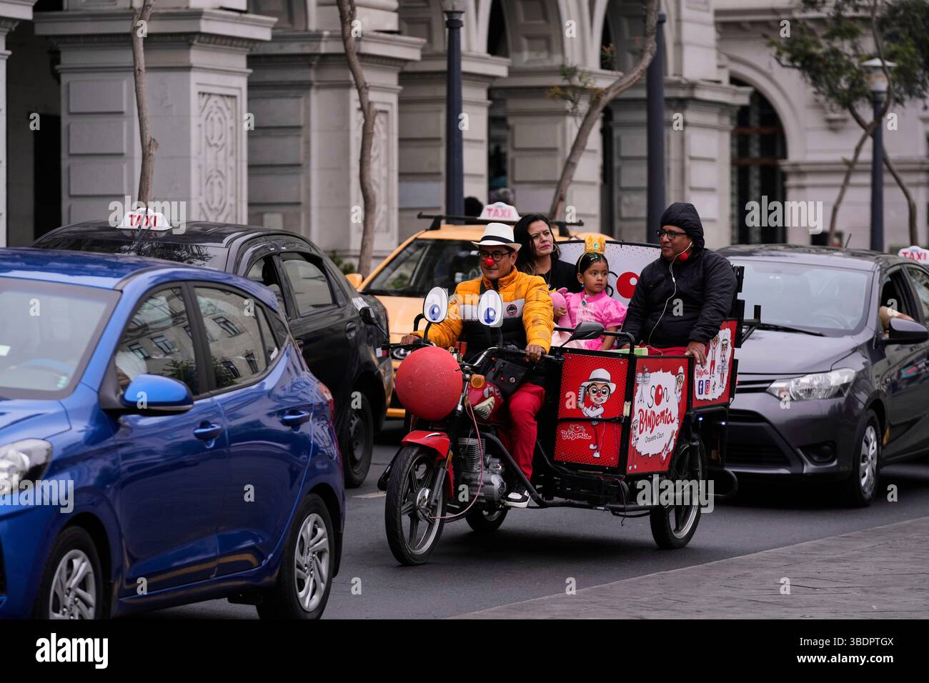 A clown gives his family a ride to National Clown Day celebrations in ...
