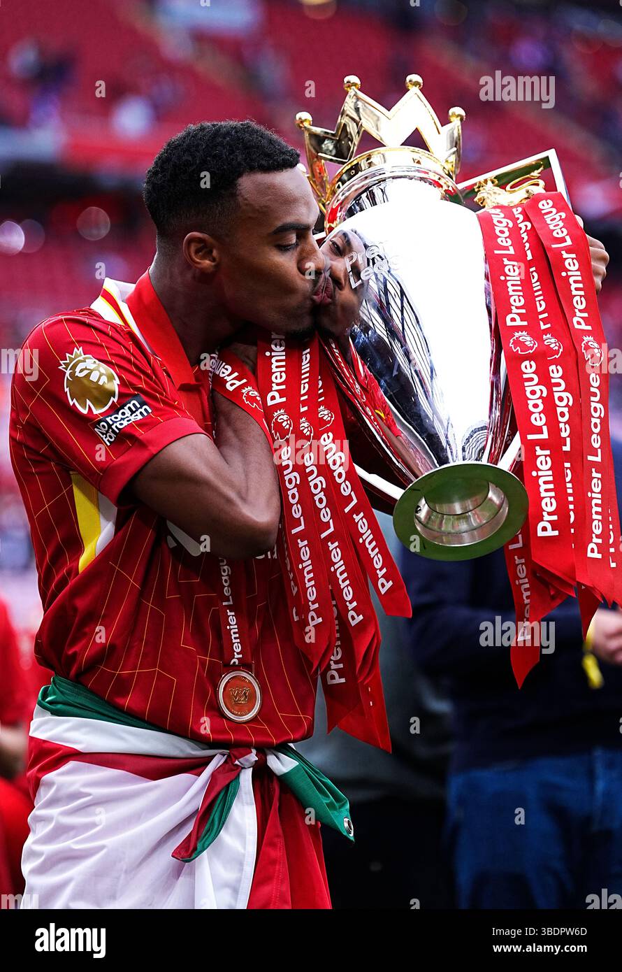 Liverpool's Ryan Gravenberch celebrates with the Premier League trophy ...