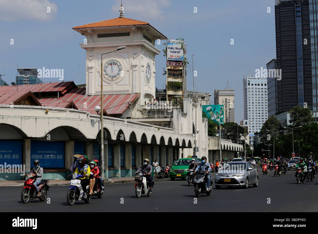 Ho Chi Minh, Vietnam - December 23, 2022: Motorcyclists ride past the ...