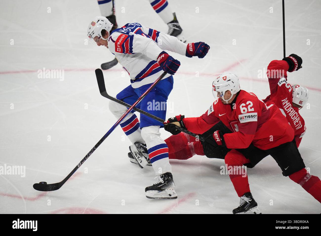 Switzerland's Denis Malgin hooks United States' Michael Kesselring ...