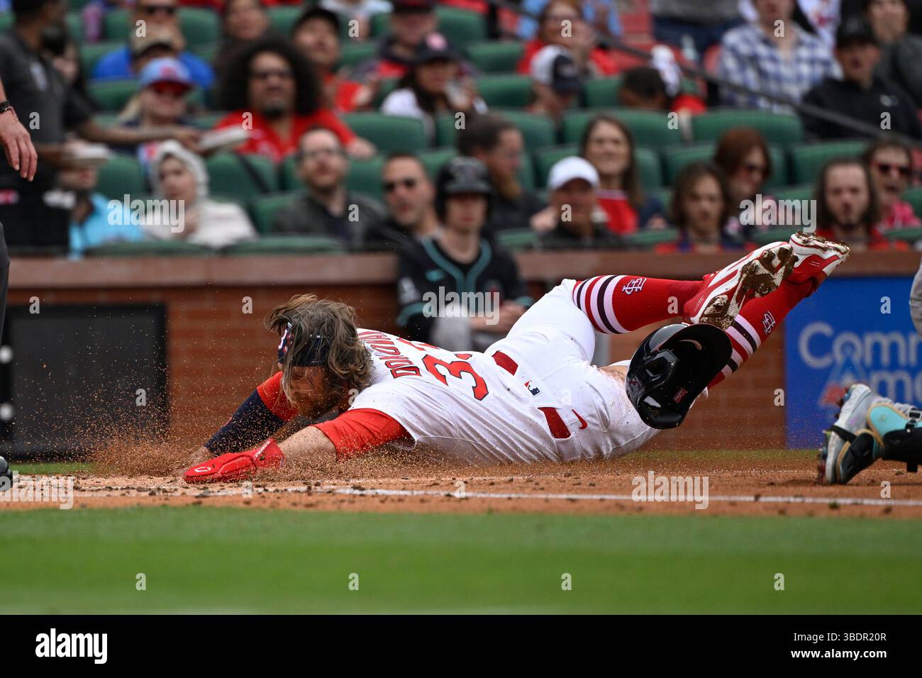 St. Louis Cardinals' Brendan Donovan slides safely into home plate for ...