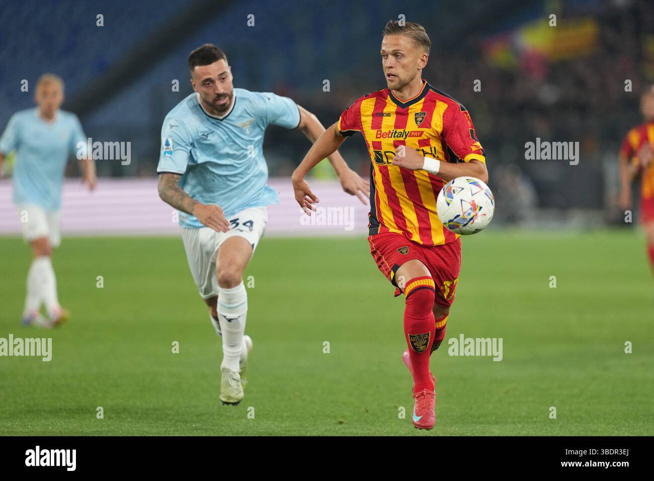 Rome, Italy. 25th May, 2025. Jesper Karlsson of US Lecce and Mario Gila ...