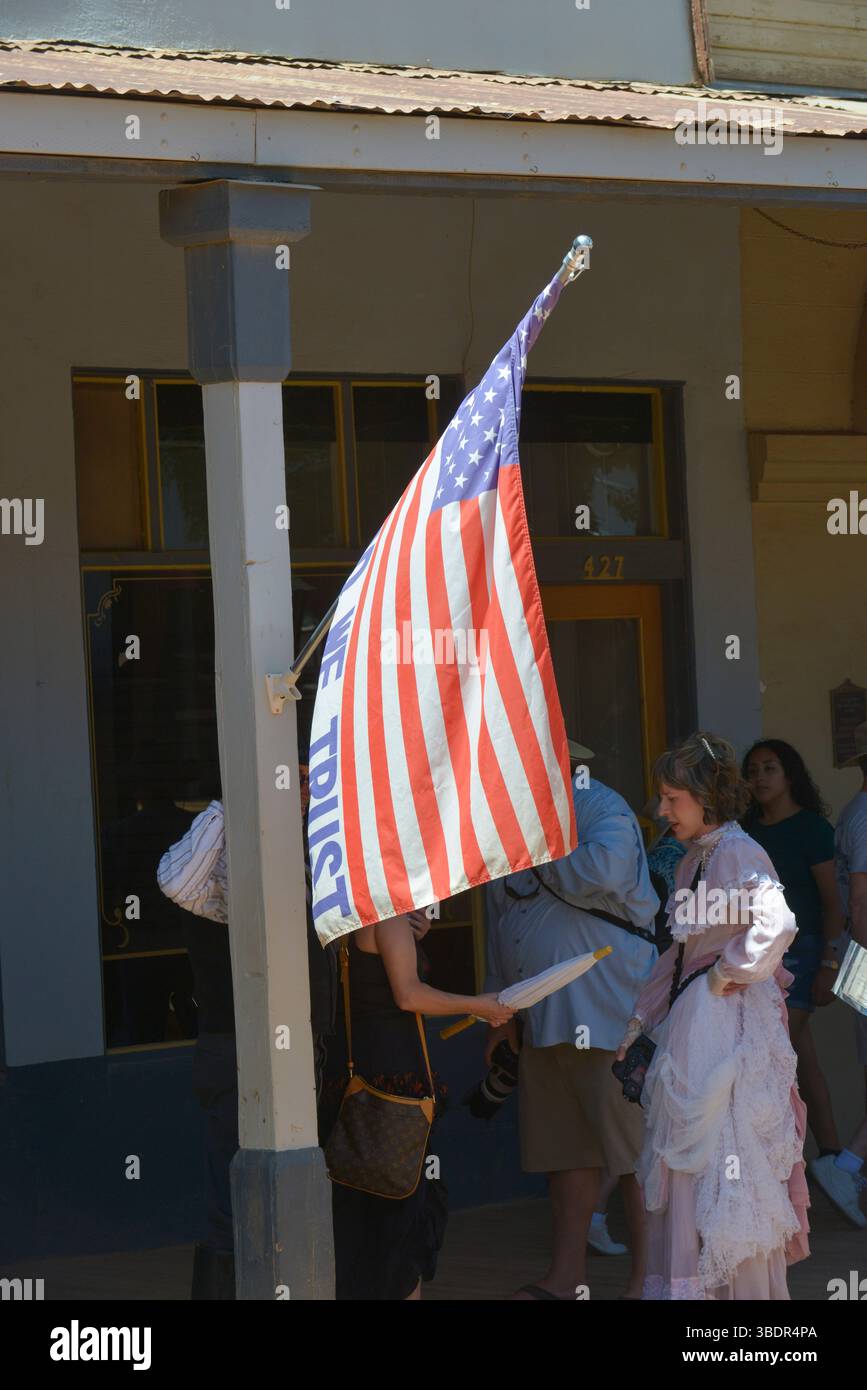 "God We Trust" American Flag on a post of the covered sidewalk in ...