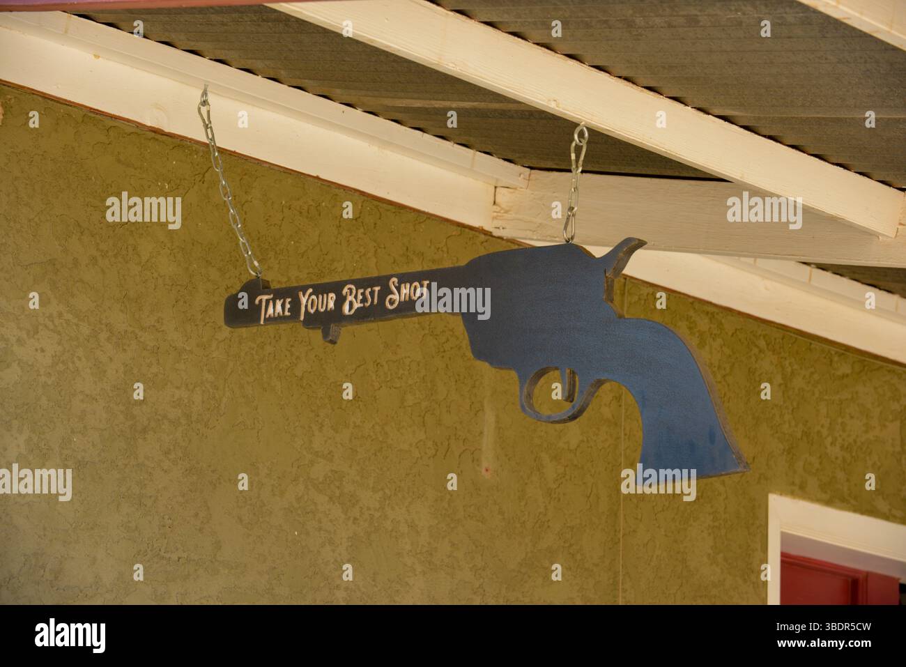 "Take Your Best Shot" Colt 45 overhead sign in Tombstone, Arizona Stock ...