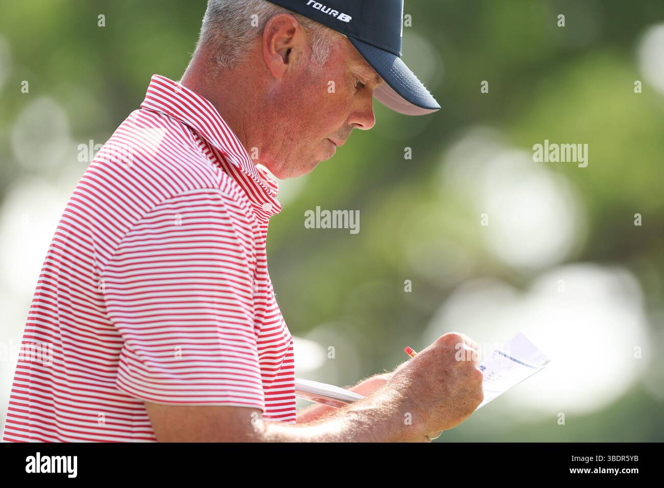 May 25, 2025: Matt Kuchar checks his scorecard on the 9th hole during ...
