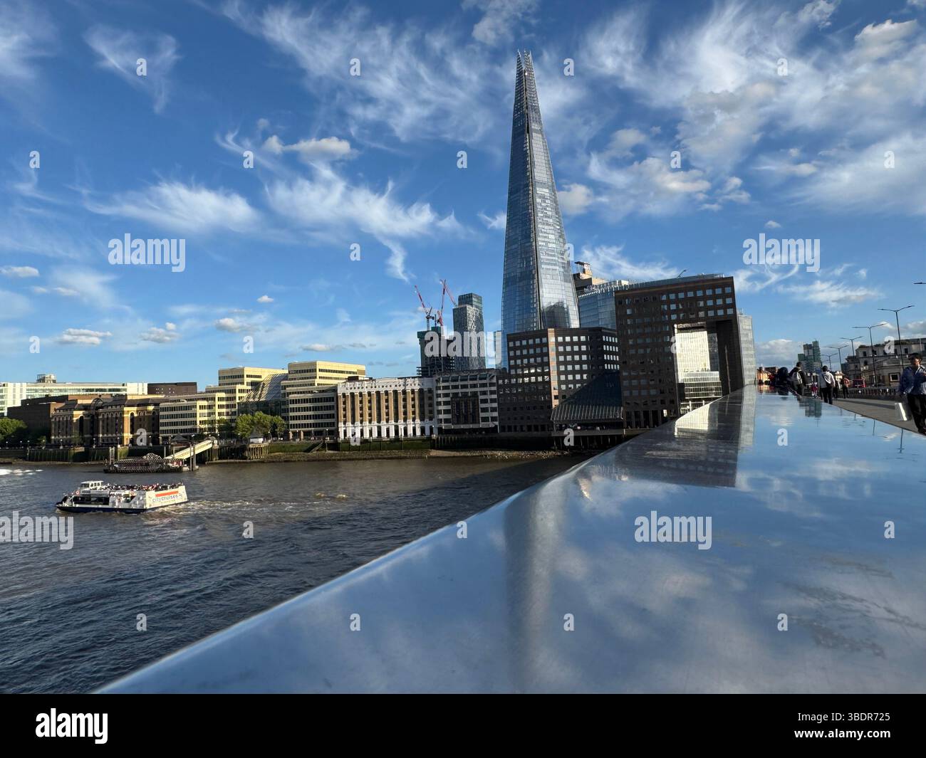 The Shard in London reflected in the hand rail of London Bridge ...