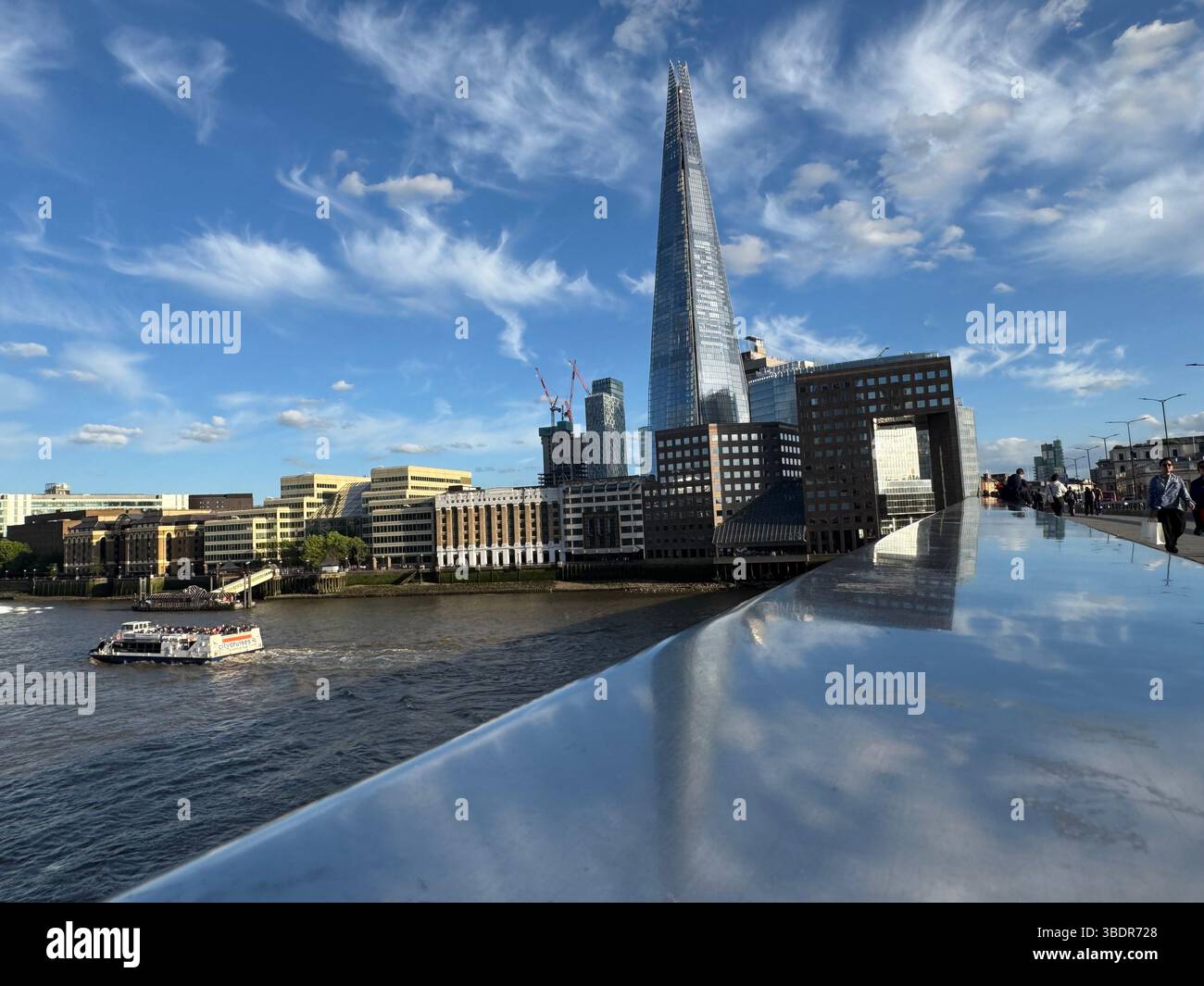 The Shard in London reflected in the hand rail of London Bridge ...
