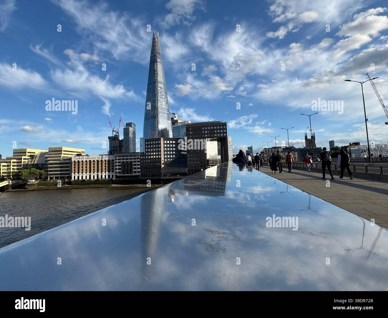 The Shard in London reflected in the hand rail of London Bridge ...