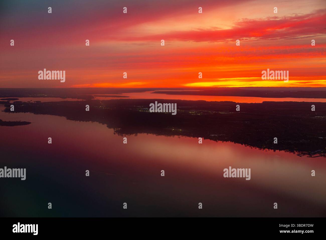 A dramatic sunset over Montreal and the islands of the St Lawrence ...