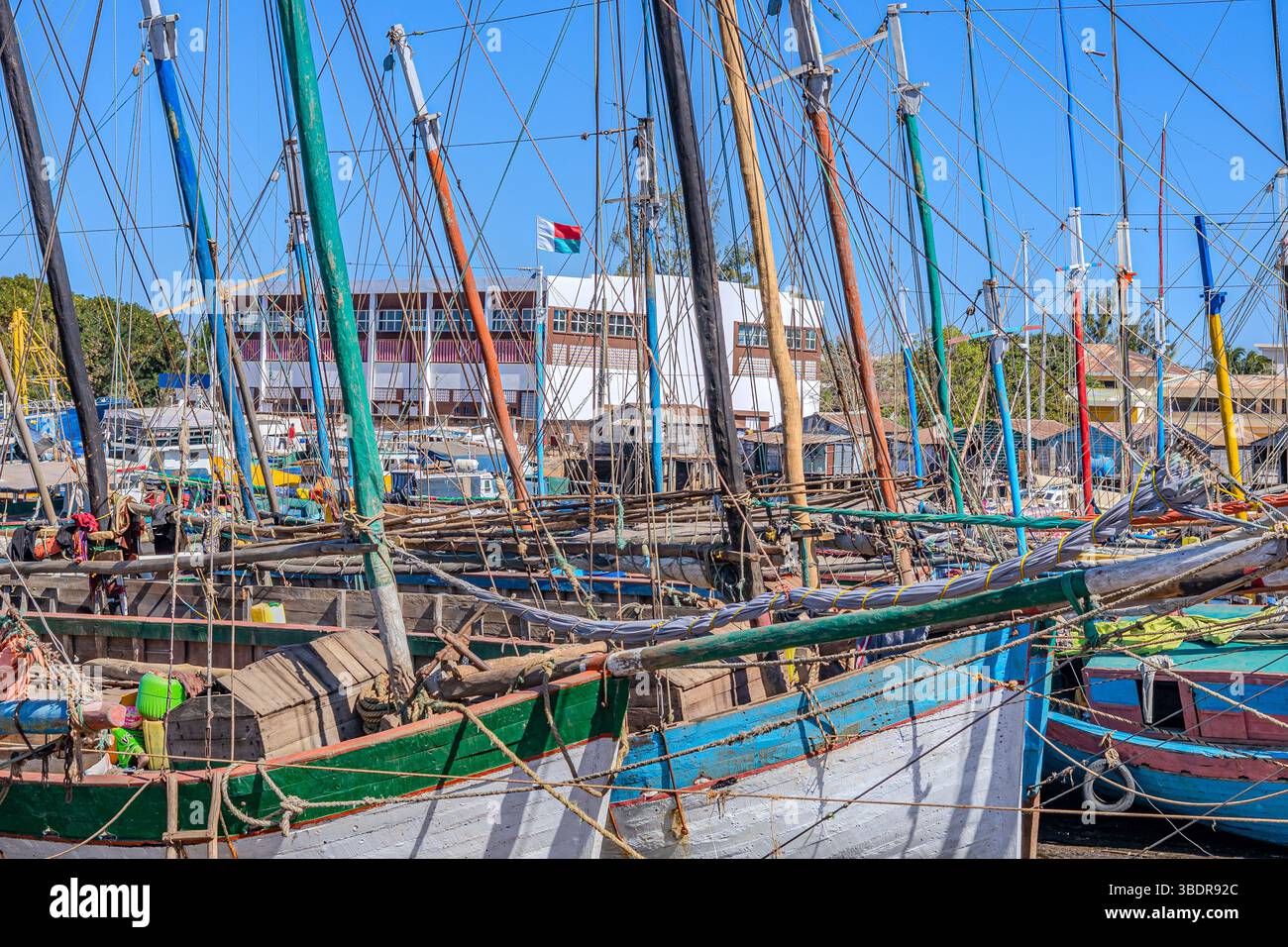 The port of Mahajanga is vibrant and bustling, featuring colorful dhows ...