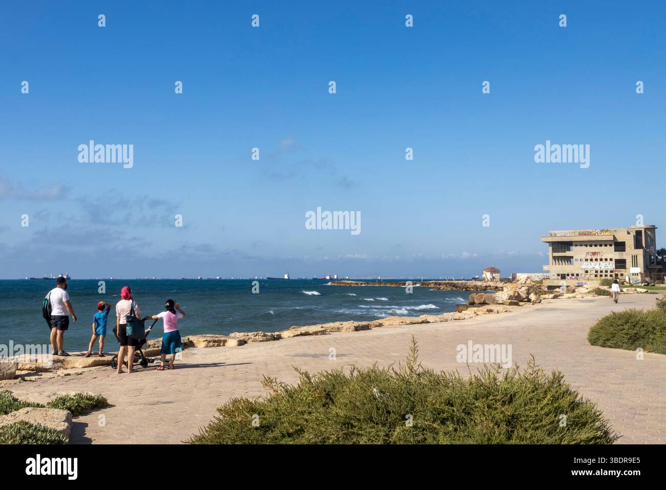Haifa, Israel – May 24, 2025. People on the Bat Galim Beach Promenade ...