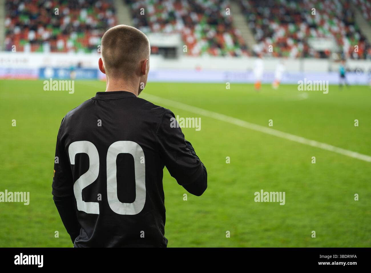 The back of a reserve player before entering the pitch Stock Photo - Alamy