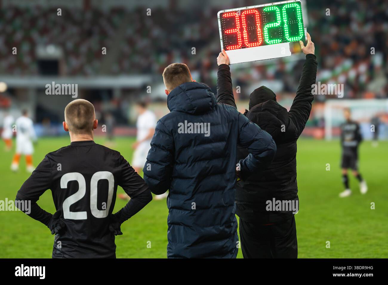 Team manager shows players substitution during football match Stock ...