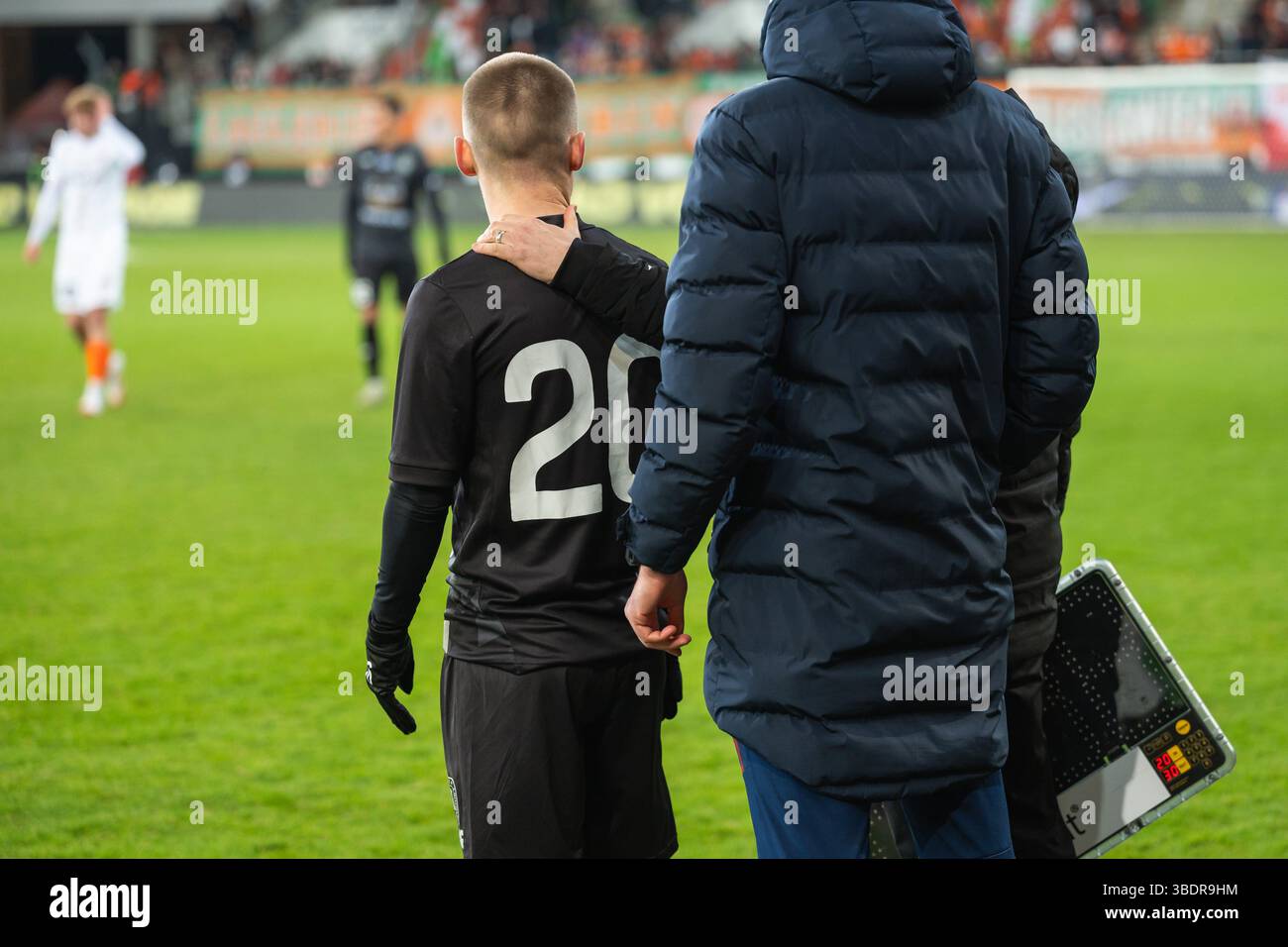The back of a reserve player before entering the pitch Stock Photo - Alamy