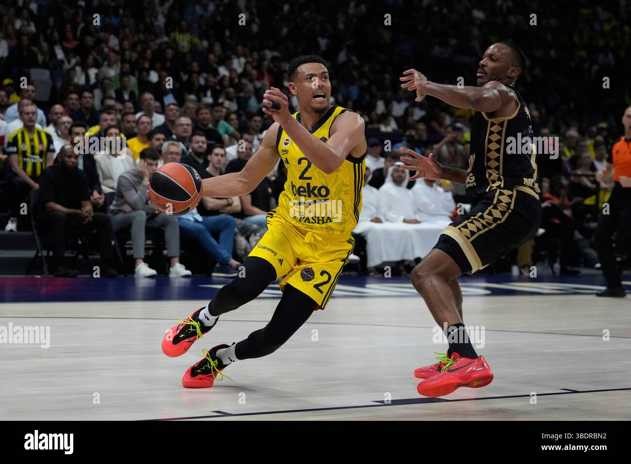 Fenerbahce's Wade Baldwin IV, left, runs with the ball during the ...