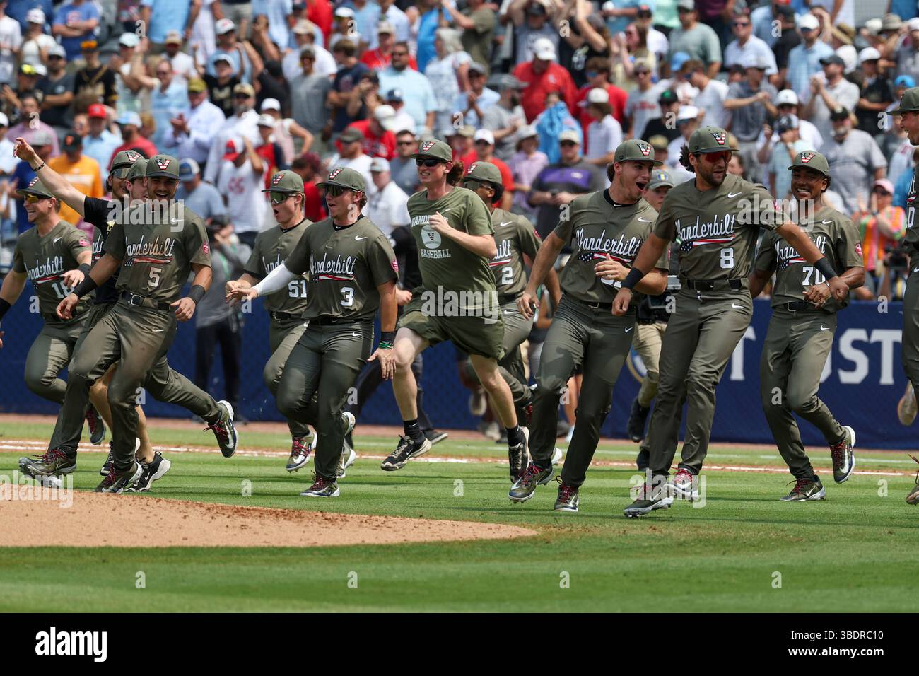 HOOVER, AL - MAY 25: Vanderbilt players rush the field after winning ...