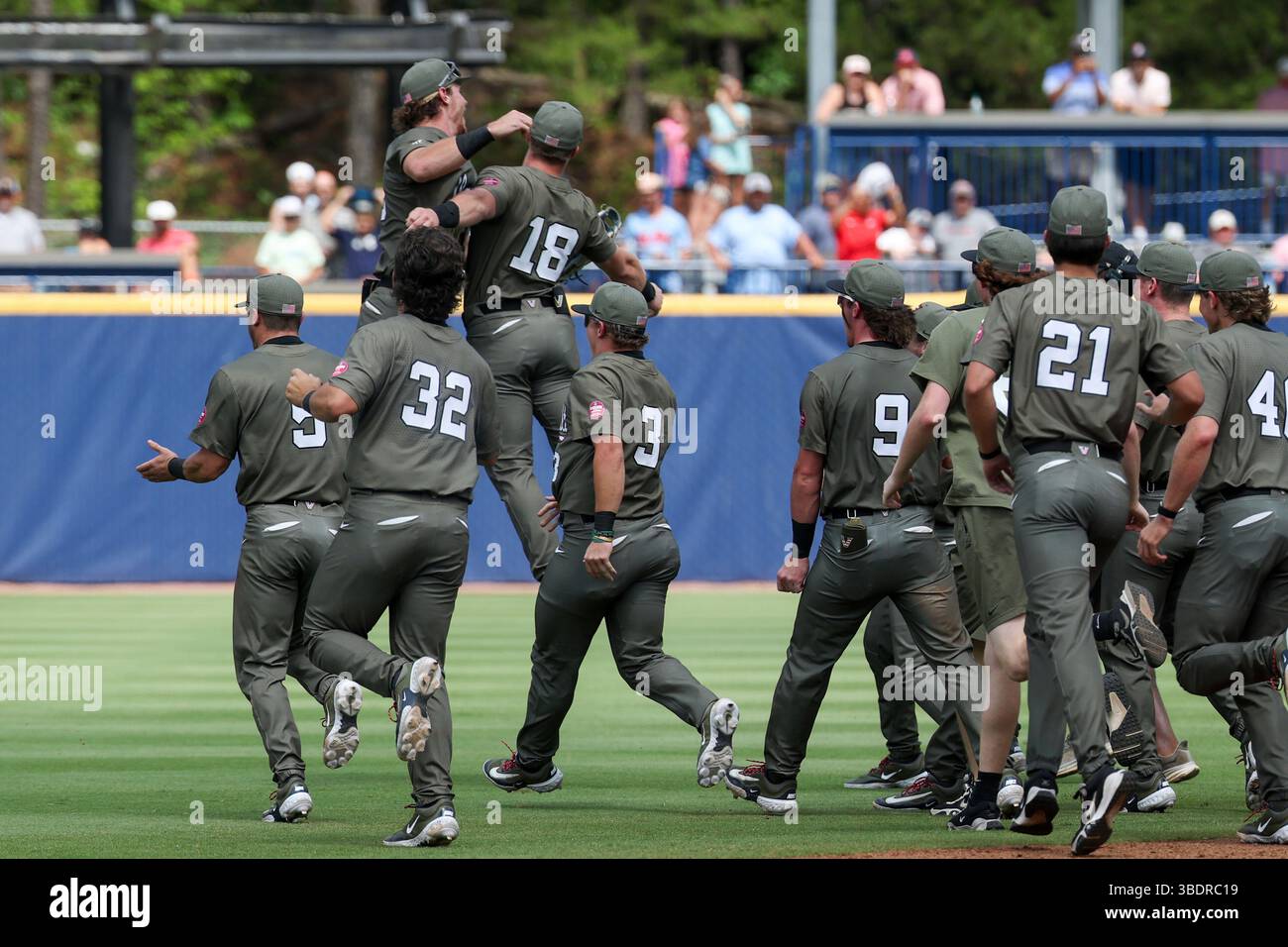 HOOVER, AL - MAY 25: Vanderbilt players rush the field after winning the SEC Baseball Tournament ...